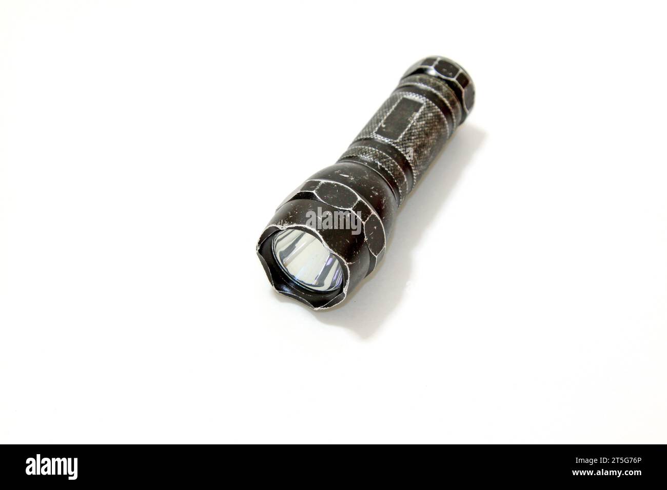 Old-fashioned pocket flashlight on a white background Stock Photo - Alamy