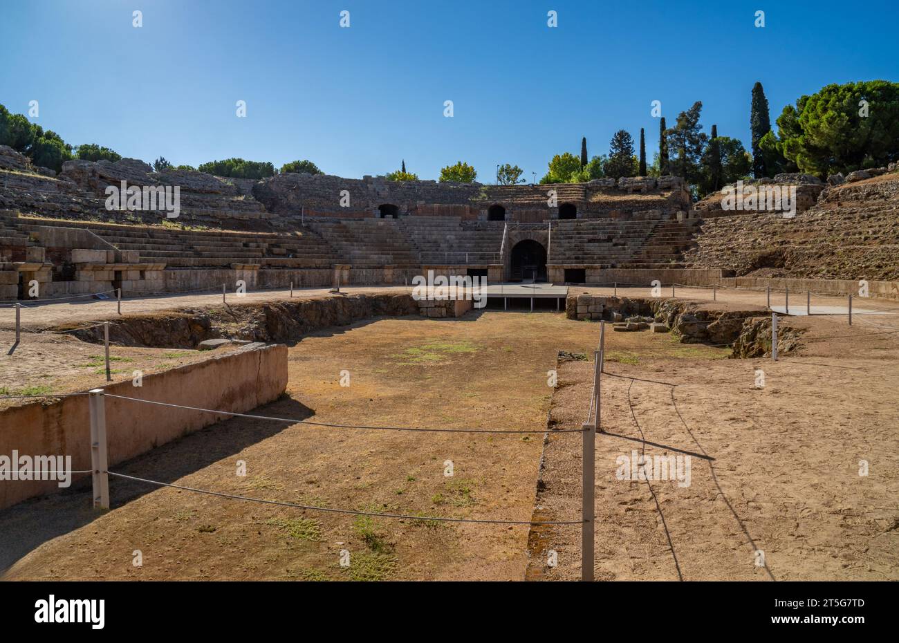 View from the arena of the Roman Amphitheater of Mérida illuminated by ...