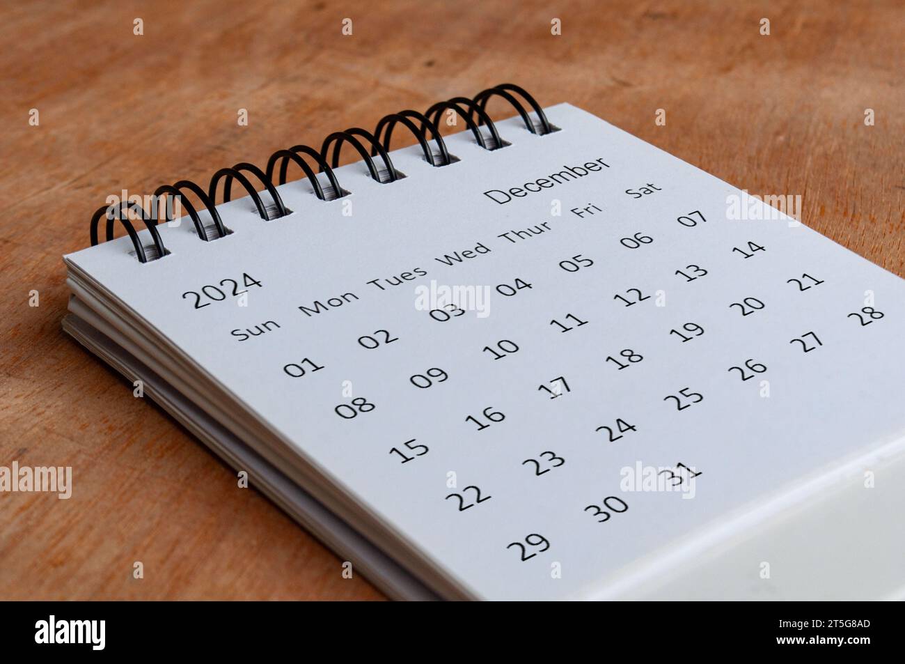 December 2024 white table calendar on wooden background. Calendar ...