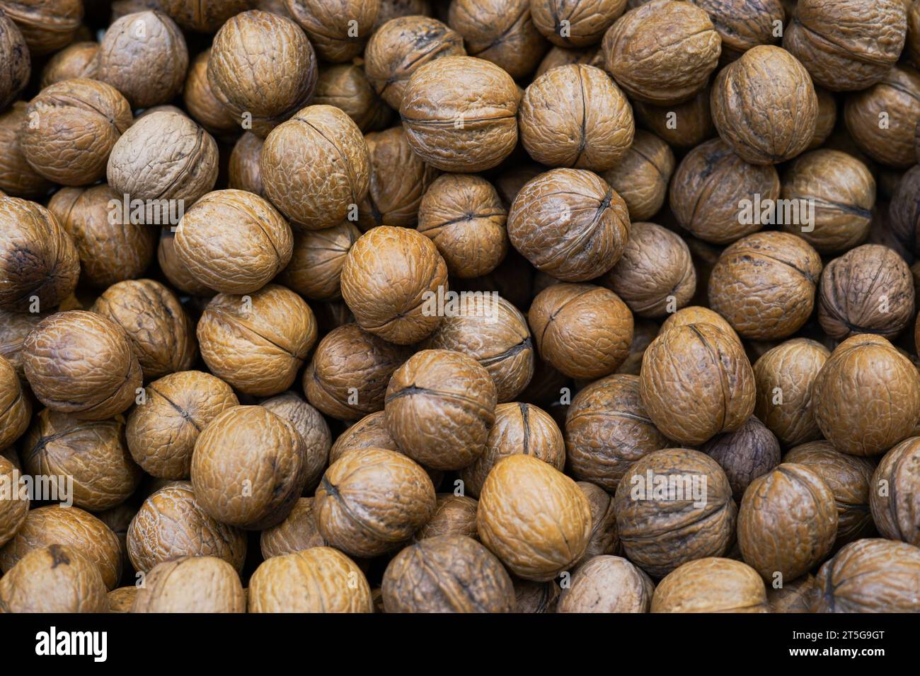 Walnuts with shells background. fresh walnuts in the store Stock Photo ...