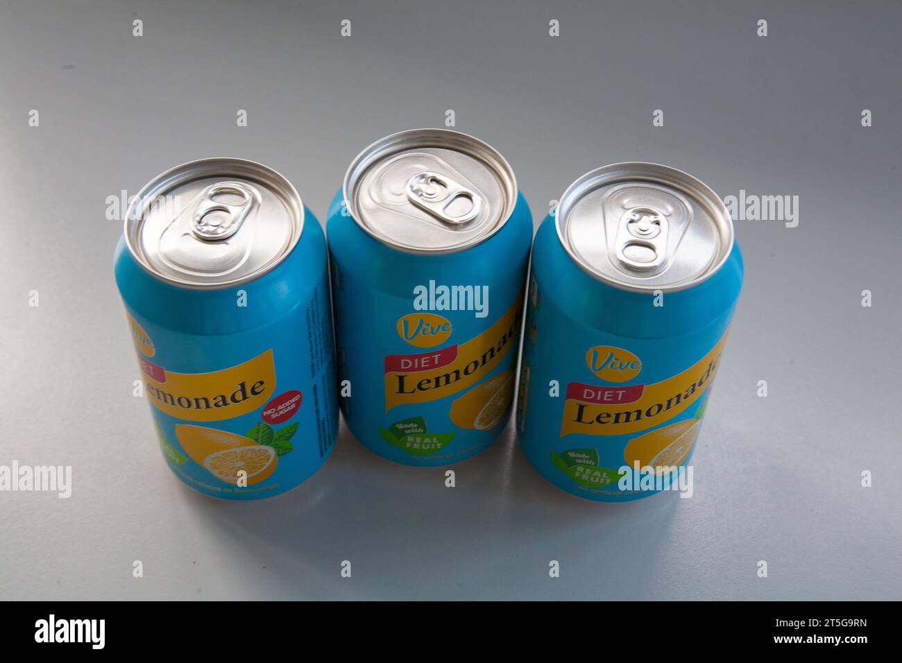 Three cans of diet lemonade with no added sugar on white background ...