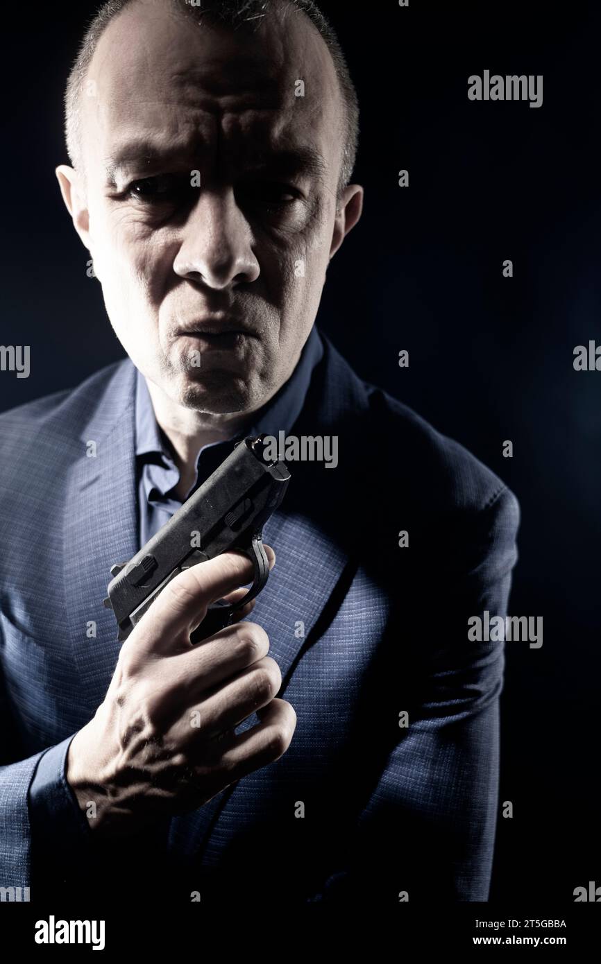 Assasin spy killer with handgun pistol in elegant suit and shirt book ...