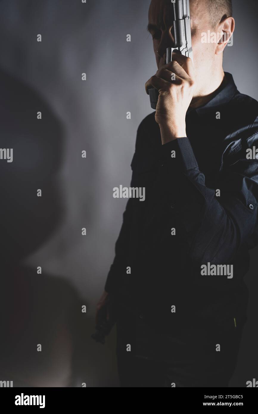 Gangster hitman assassin holding hi-res stock photography and images ...