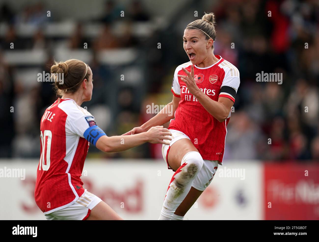 Arsenal's Steph Catley (right) celebrates scoring their side's first ...