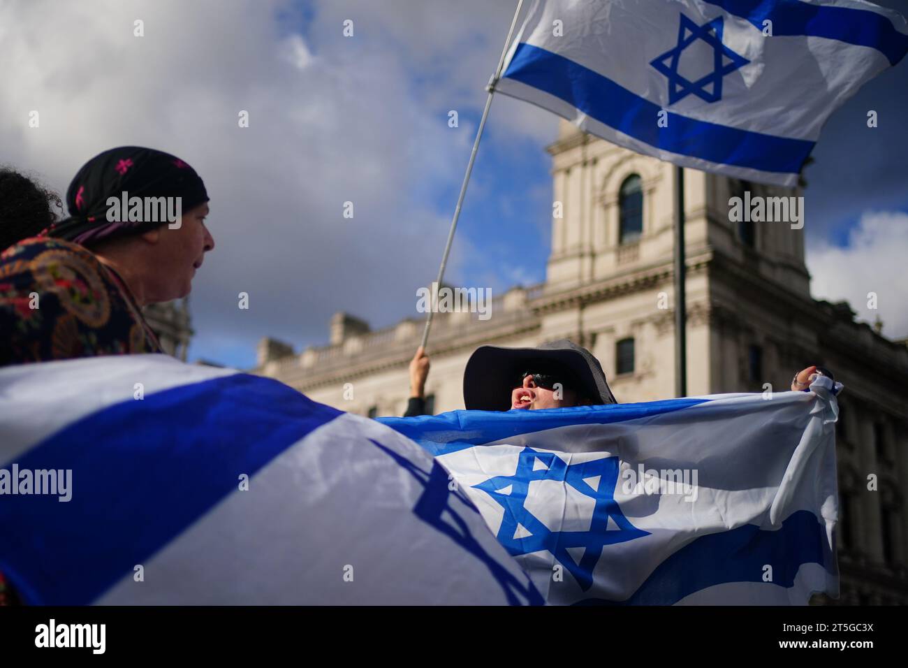 People take part in a pro-Israel rally in Parliament Square in London ...