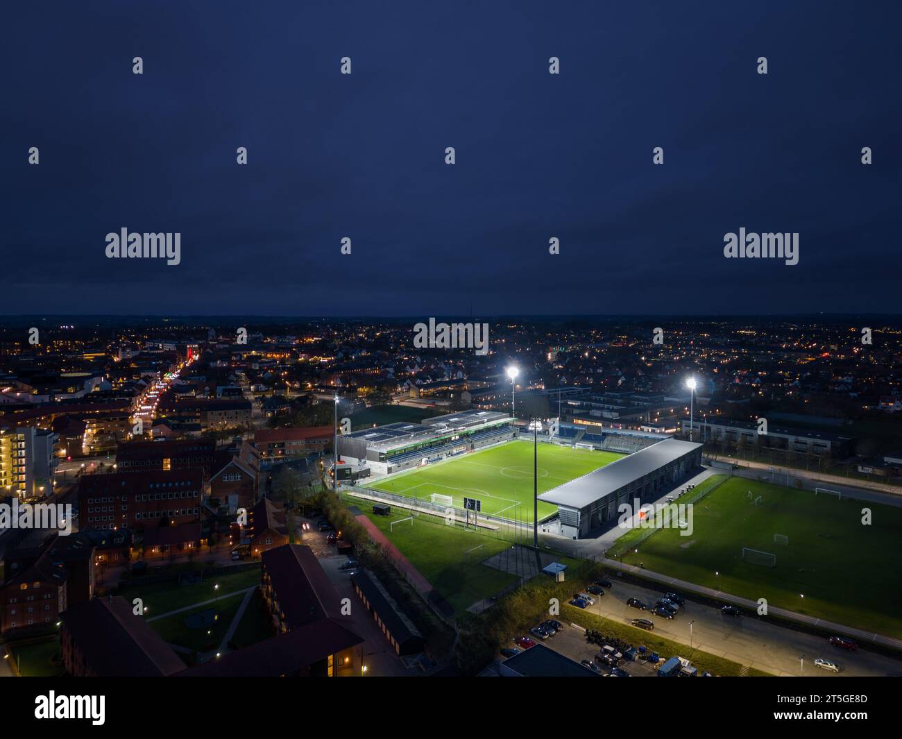 Hjørring, Denmark: Aerial night view of the illuminated Hjørring ...