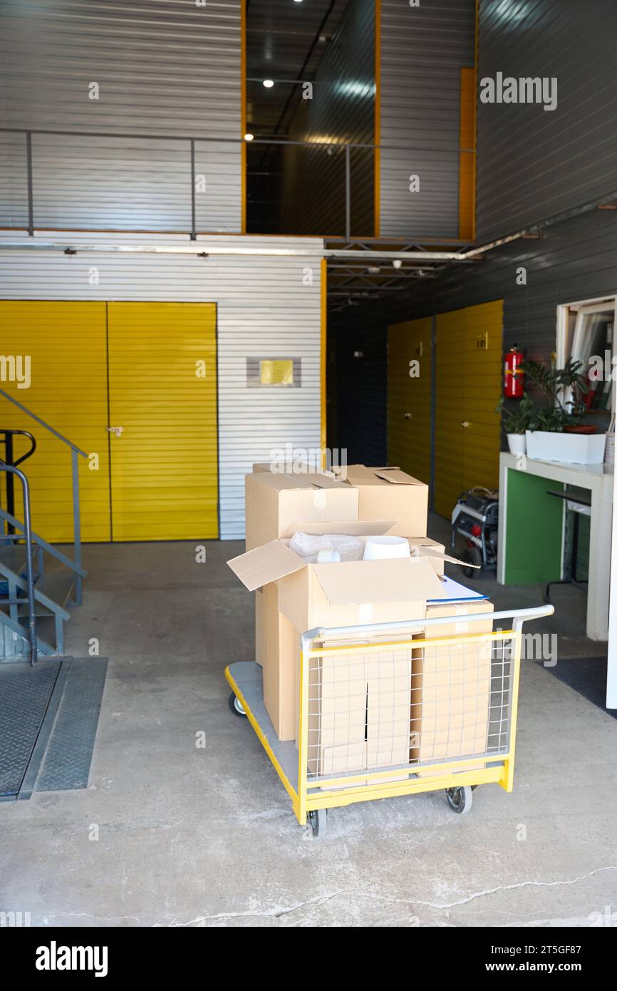 Cargo cart on small wheels stands at the freight elevator Stock Photo ...