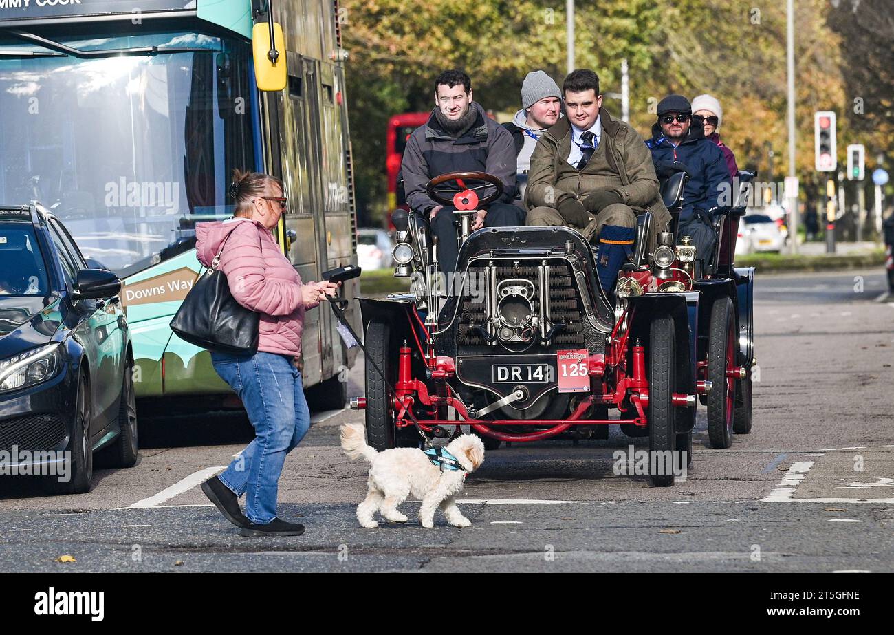Brighton UK 5th November 2023 - Passengers in a 1902 M.M.C. are closely ...