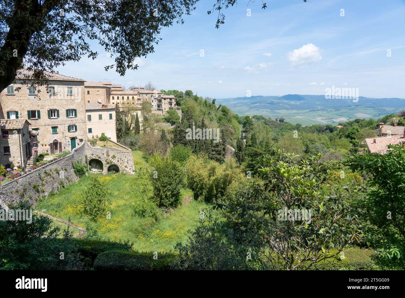 view over rooftops of an Italian hillside village to open countryside ...