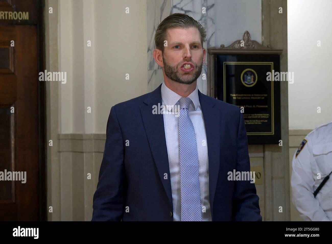 Eric Trump speaks to journalists after testifying at the Trump family's ...