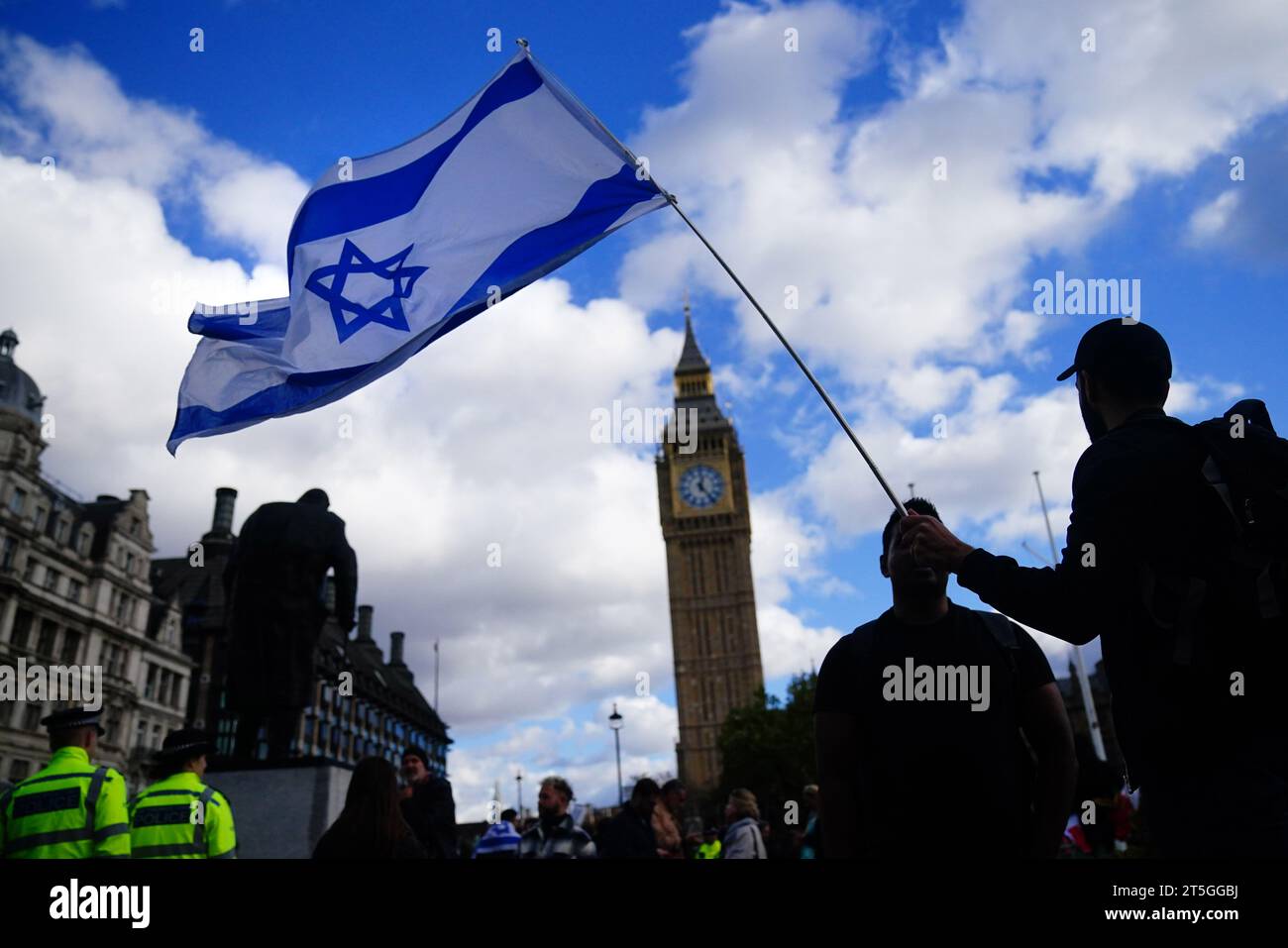 People take part in a pro-Israel rally in Parliament Square in London ...