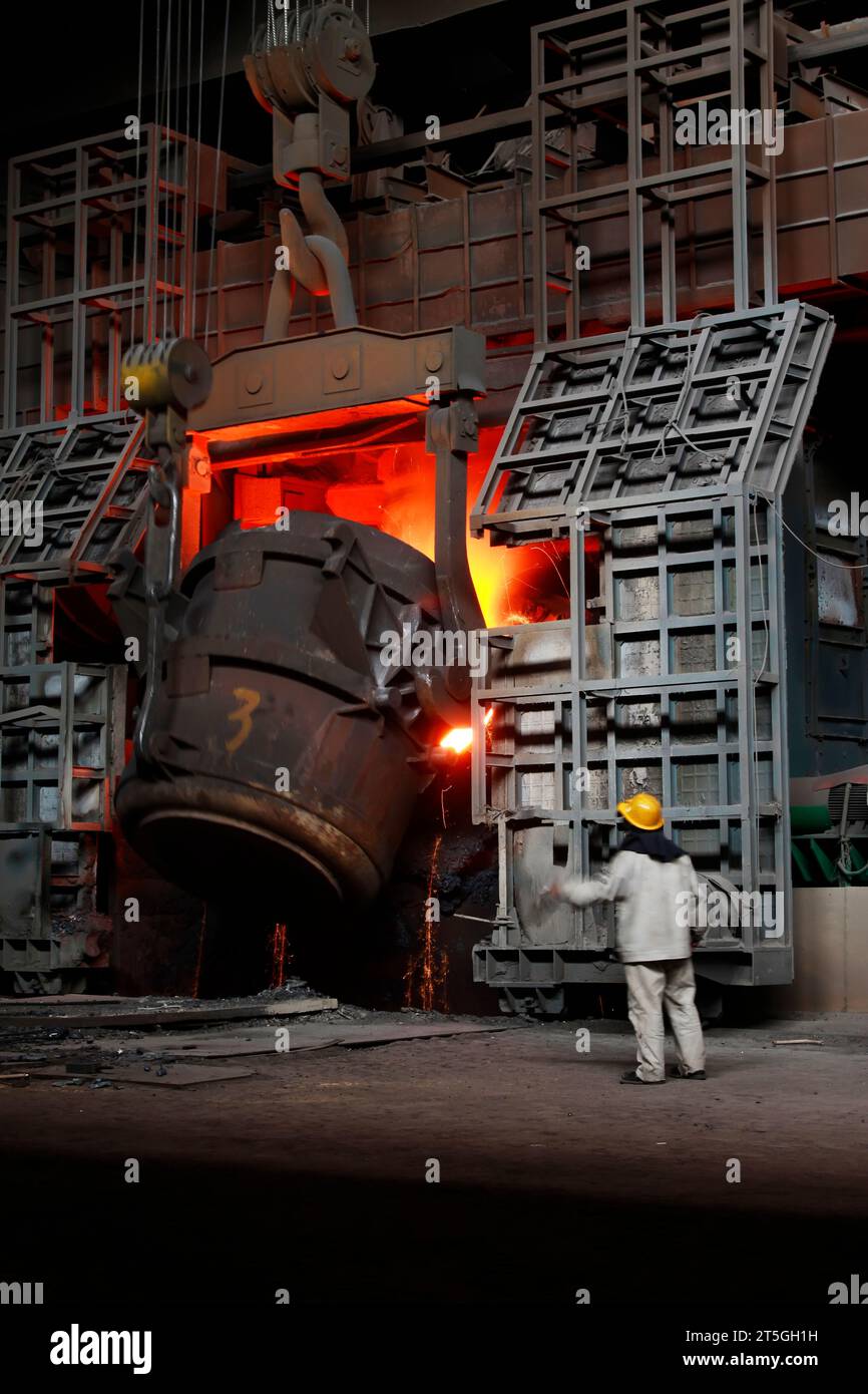 Iron and steel industry furnace and operating workers Stock Photo - Alamy
