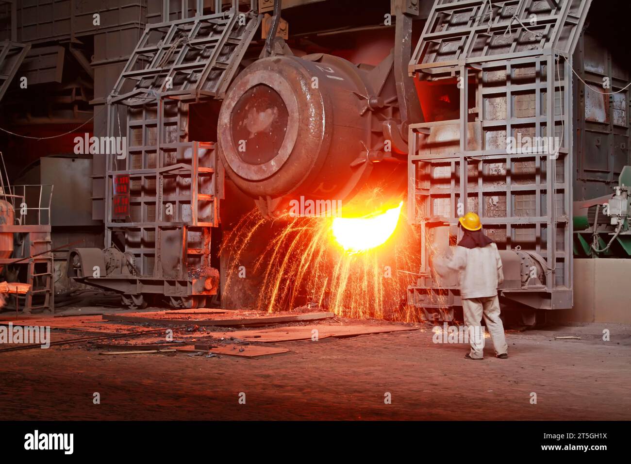 Iron and steel industry furnace and operating workers Stock Photo - Alamy