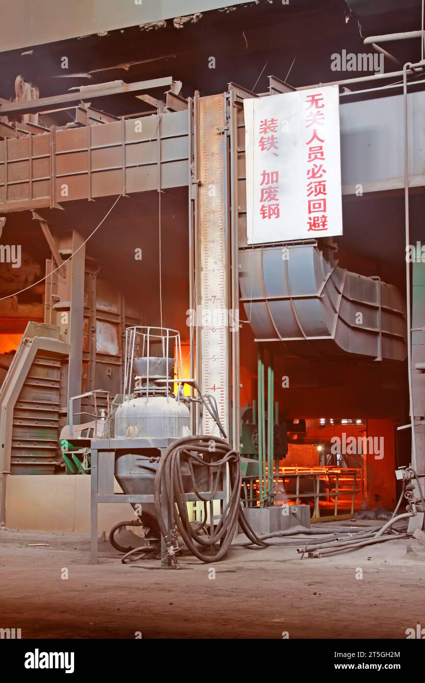 iron and steel industry furnaces and warning signs Stock Photo - Alamy