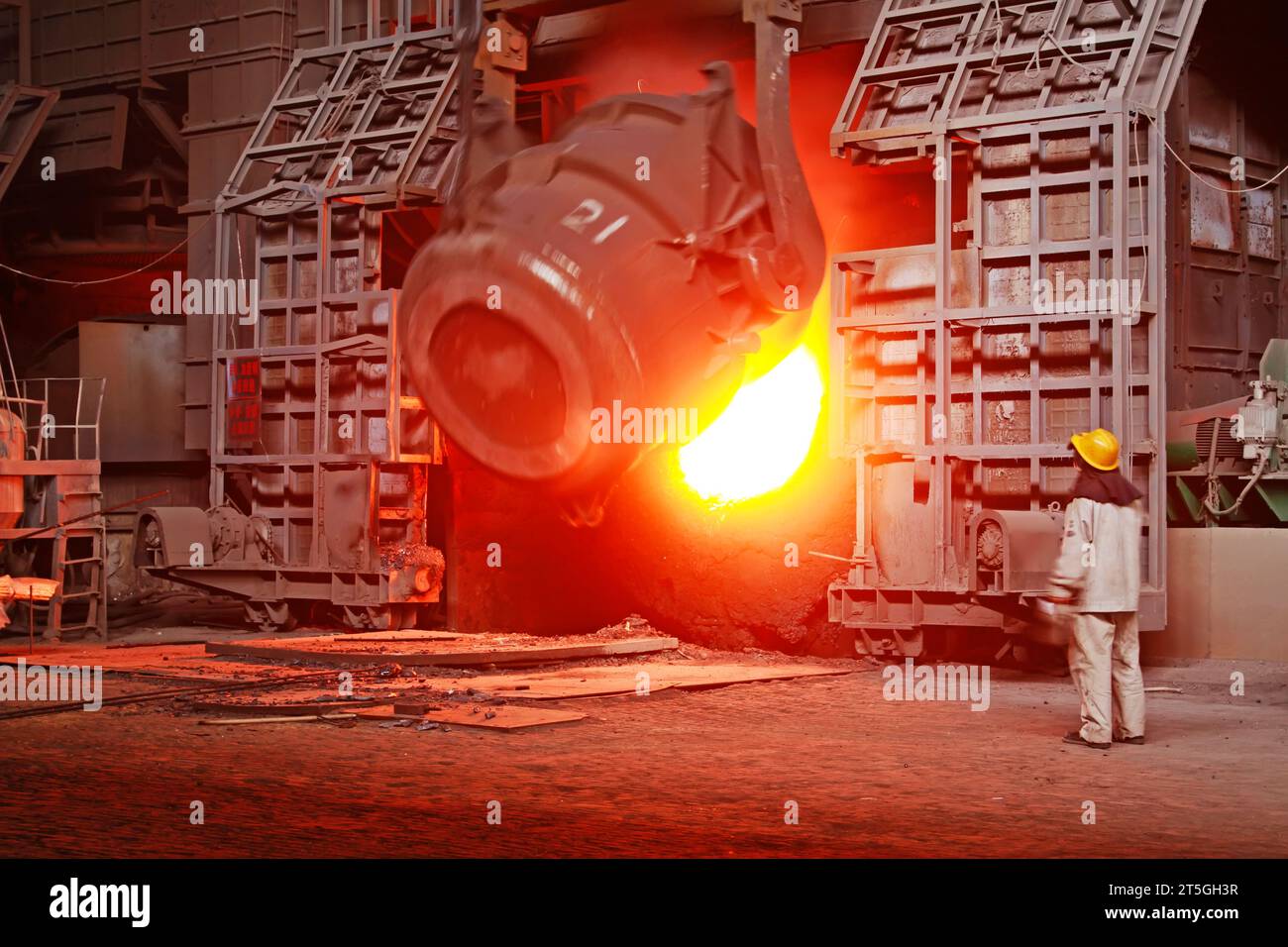 Iron and steel industry furnace and operating workers Stock Photo - Alamy
