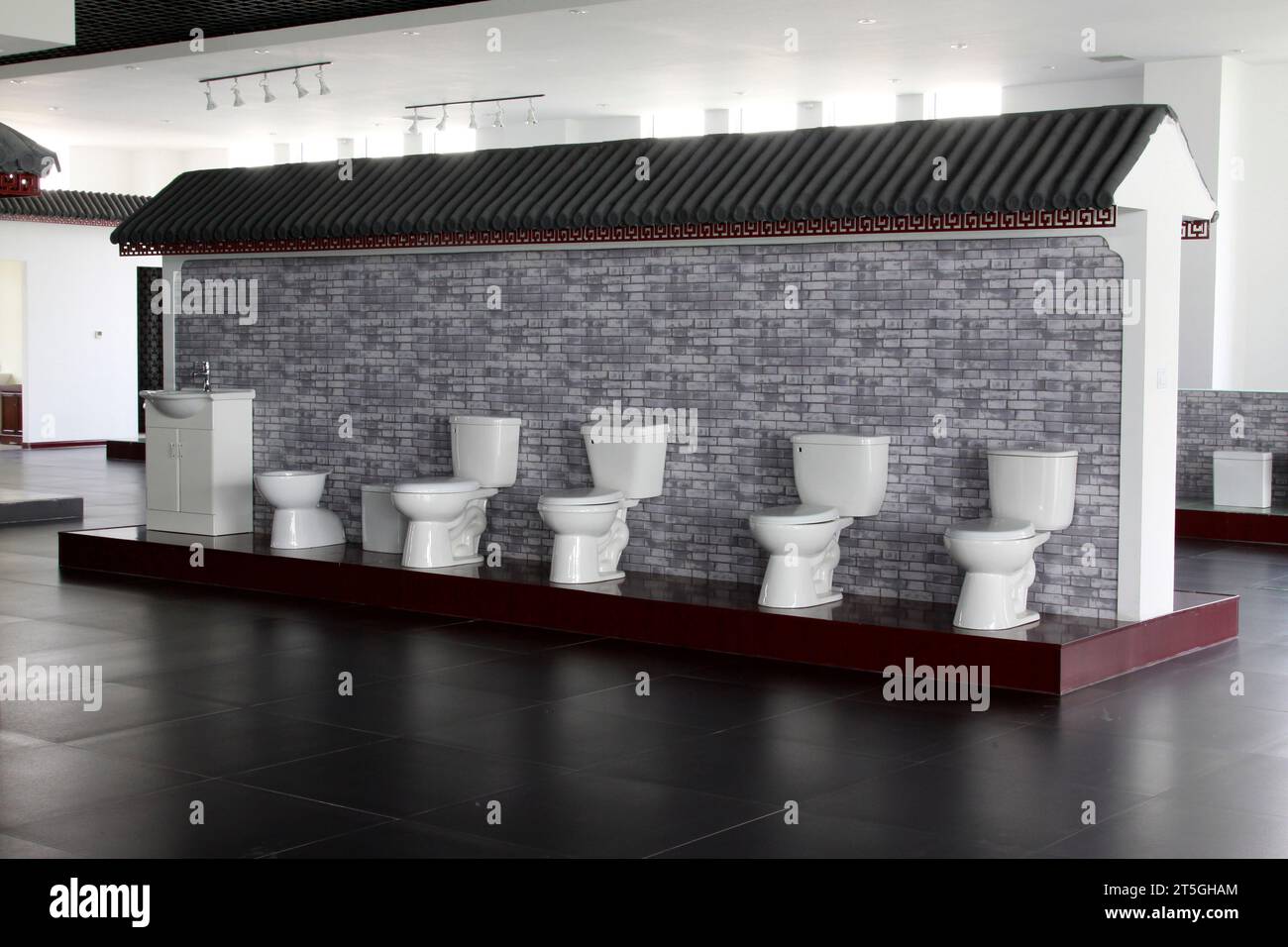 Ceramic toilet display in a hall, closeup of photo Stock Photo - Alamy