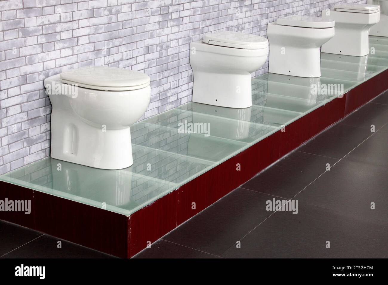 Ceramic toilet display in a hall, closeup of photo Stock Photo - Alamy