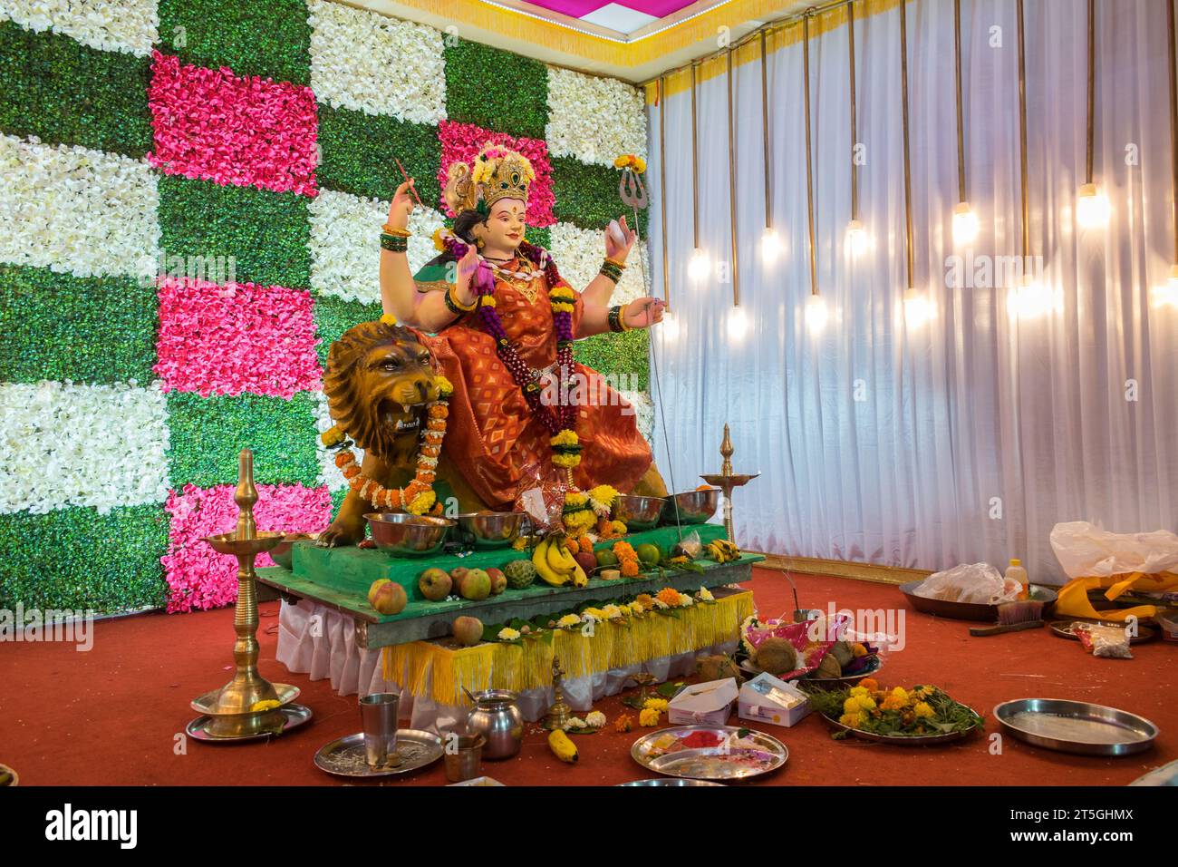 A beautiful idol of Maa Durga being worshipped at a pandal during ...