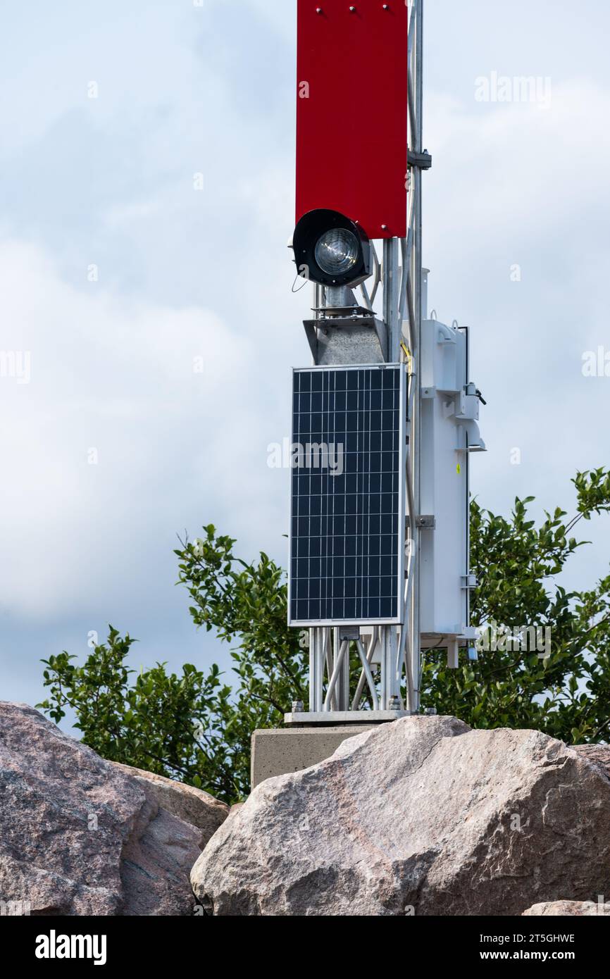 Port leading light powered by solar cells Stock Photo - Alamy