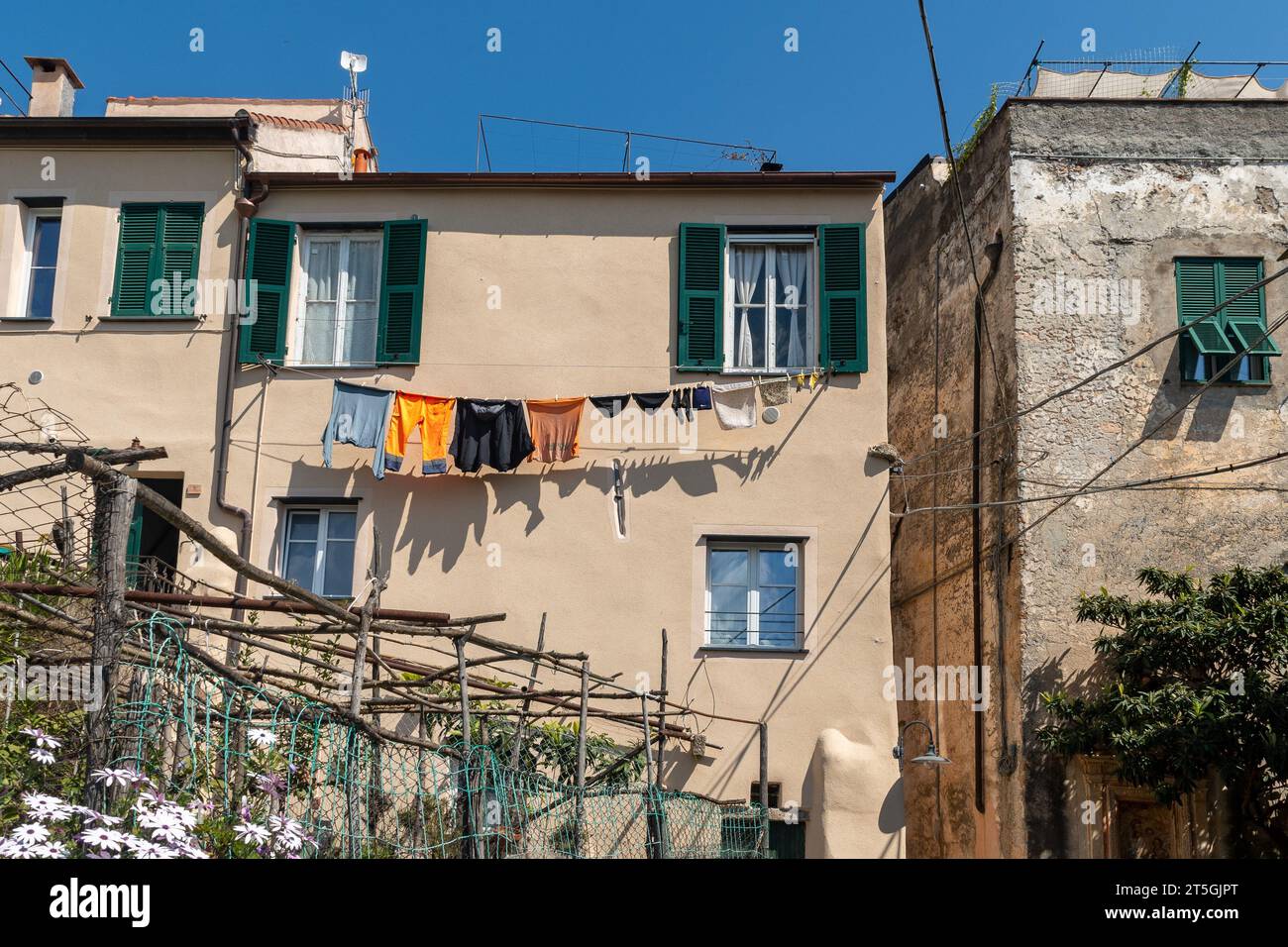 Old houses with washing lines in the ancient village of Borgata Crosa ...