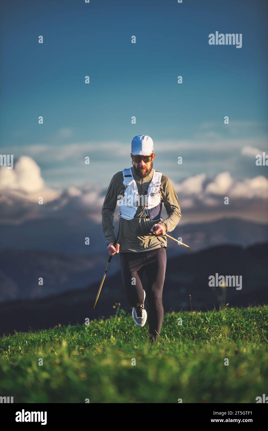 Lonely man during a hillside training trail Stock Photo - Alamy