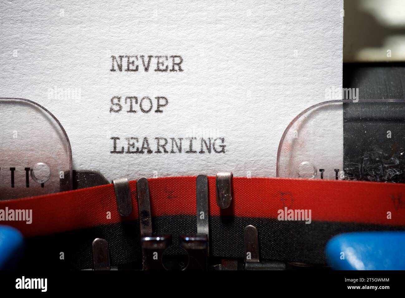 Never stop learning phrase written with a typewriter Stock Photo - Alamy