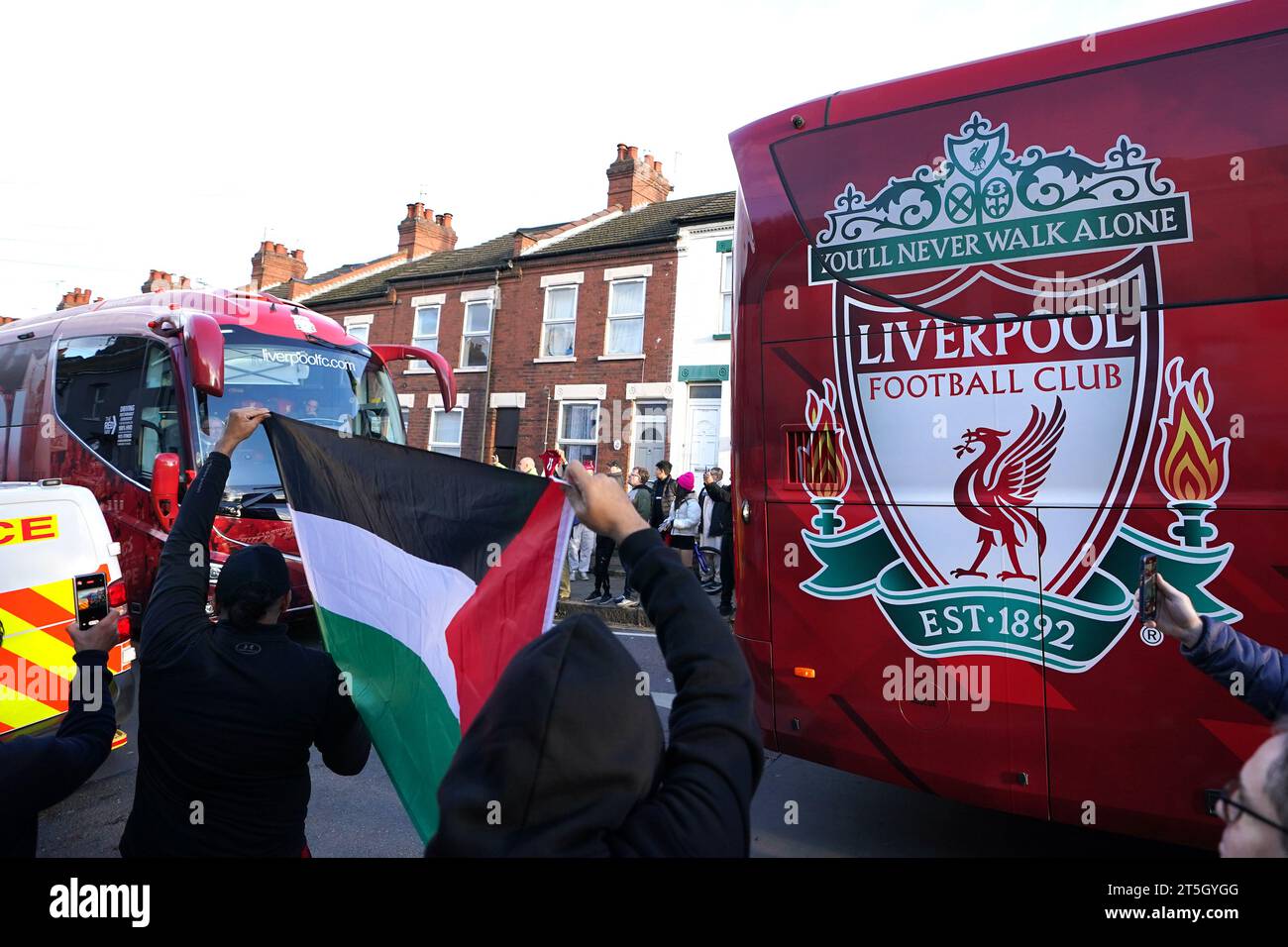 The flag of Palestine is held up by members of the public outside the ...