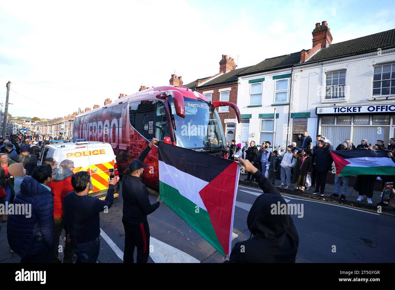 The flag of Palestine is held up by members of the public outside the ...