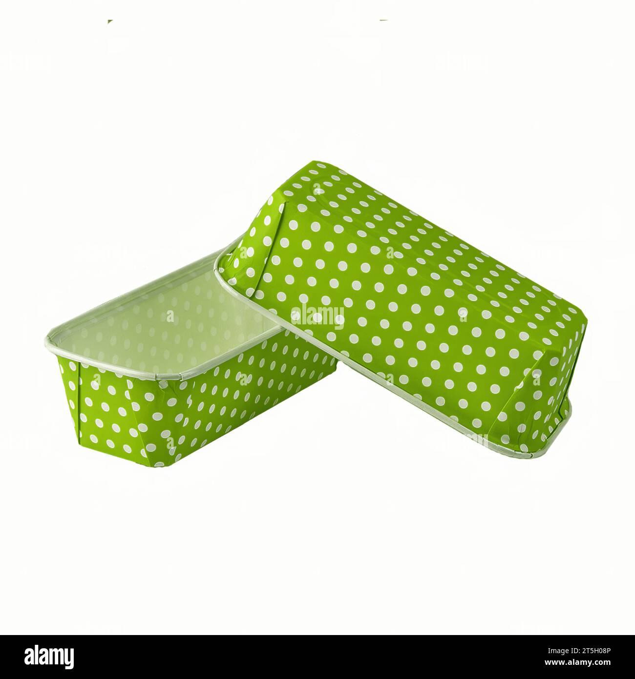 Green paper baking forms for cakes with dotted pattern isolated over ...