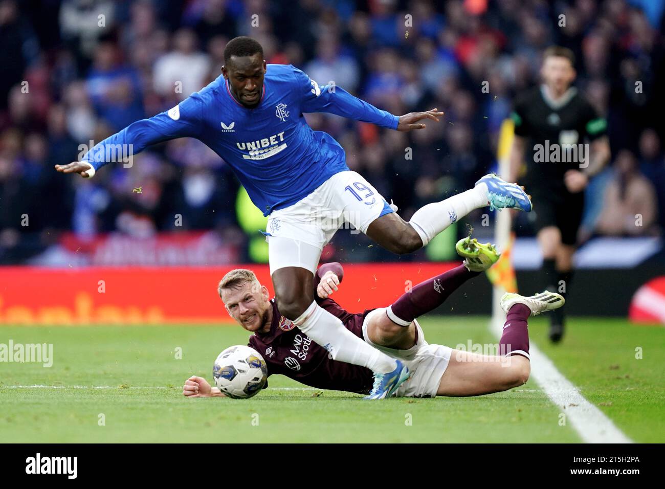 Rangers' Abdallah Sima (above) and Heart of Midlothian's Stephen ...