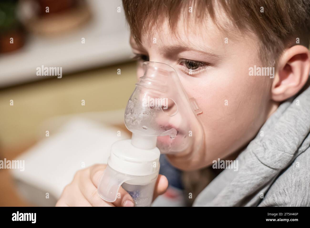 Asthma COPD Breath Nebulizer Mask on the Face of a Boy Being Treated ...