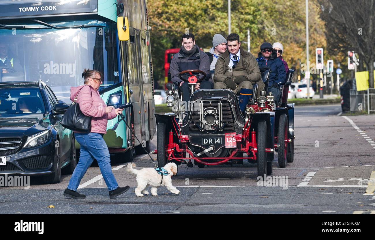 Brighton UK 5th November 2023 - Passengers in a 1902 M.M.C. are closely ...