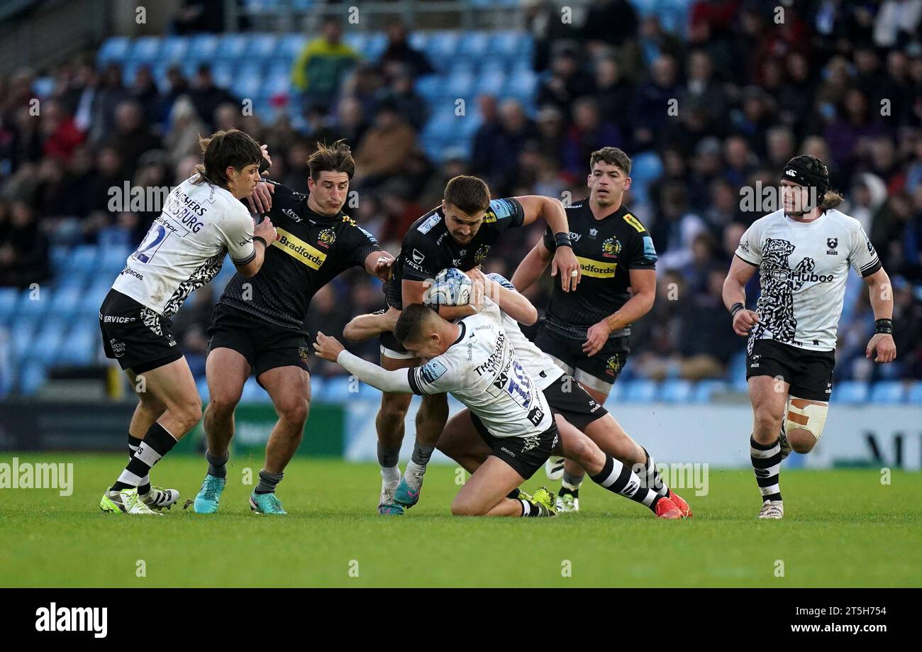 Exeter Chiefs' Henry Slade is tackled by Bristol Bears' Callum Sheedy ...