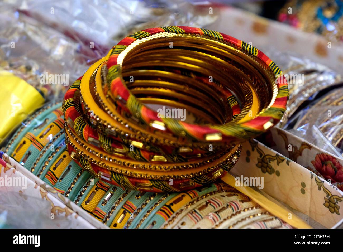 Indian bangles displayed in local shop in a market of Pune, India ...