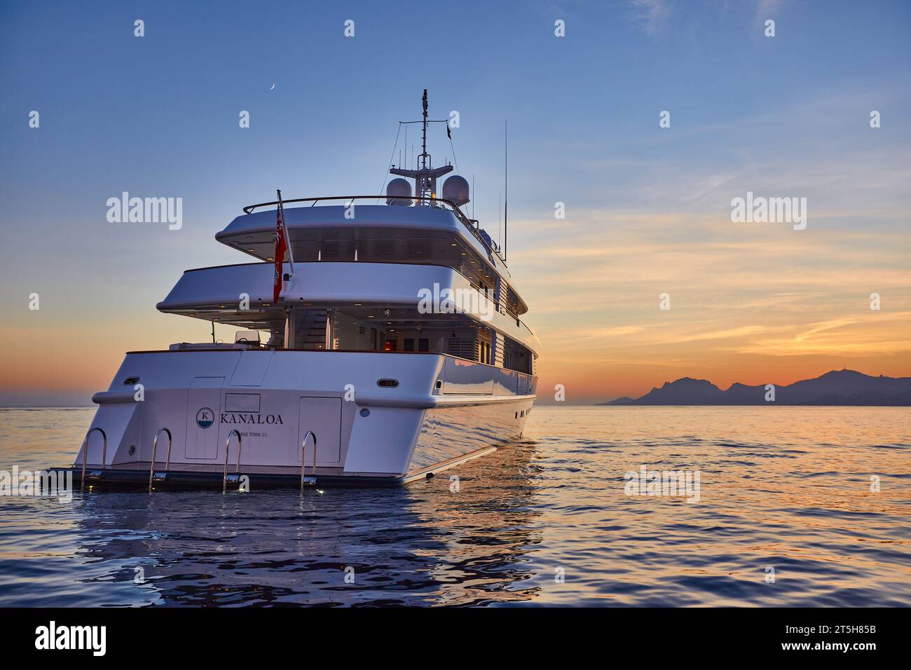 Luxury Charter Yacht at Sunset on Serene Ocean Waters in Scenic Coastal ...