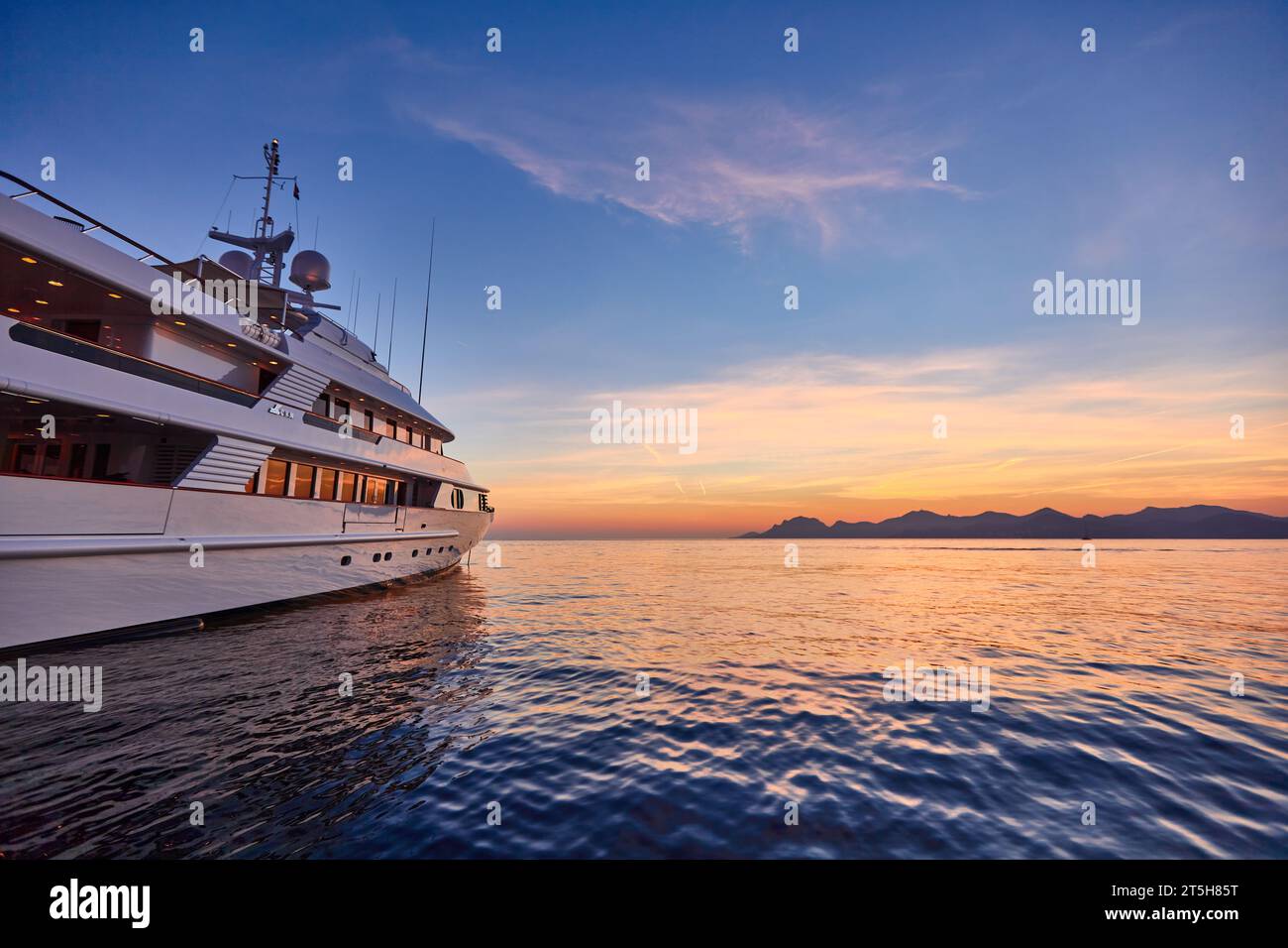 Luxury Charter Yacht at Sunset on Serene Ocean Waters in Scenic Coastal ...
