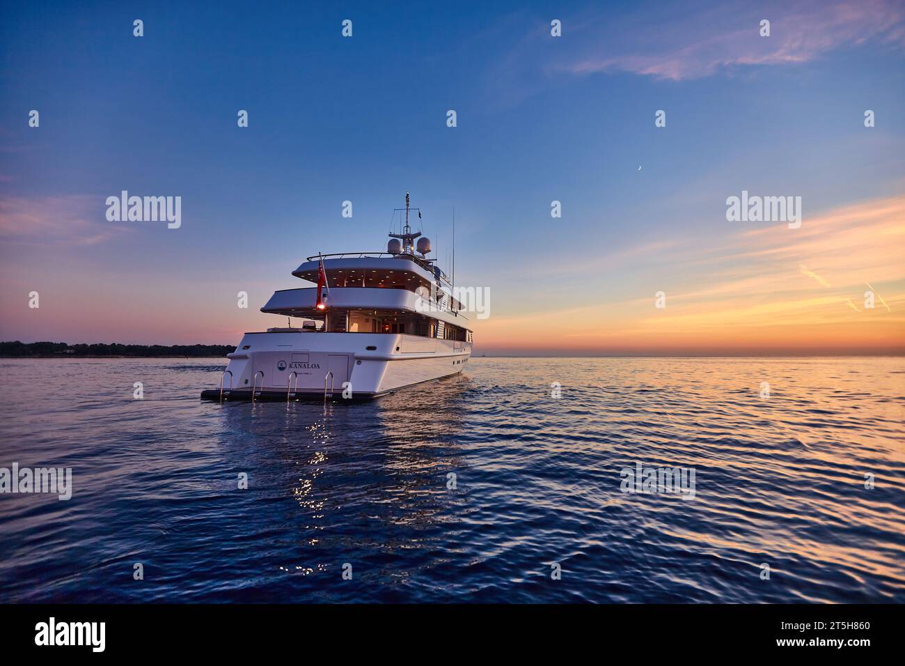 Luxury Charter Yacht at Sunset on Serene Ocean Waters in Scenic Coastal ...