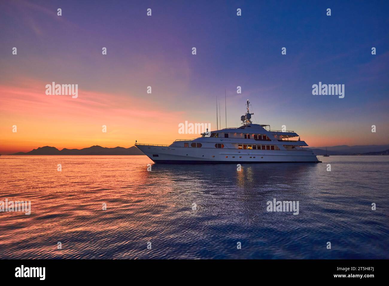 Luxury Charter Yacht at Sunset on Serene Ocean Waters in Scenic Coastal ...
