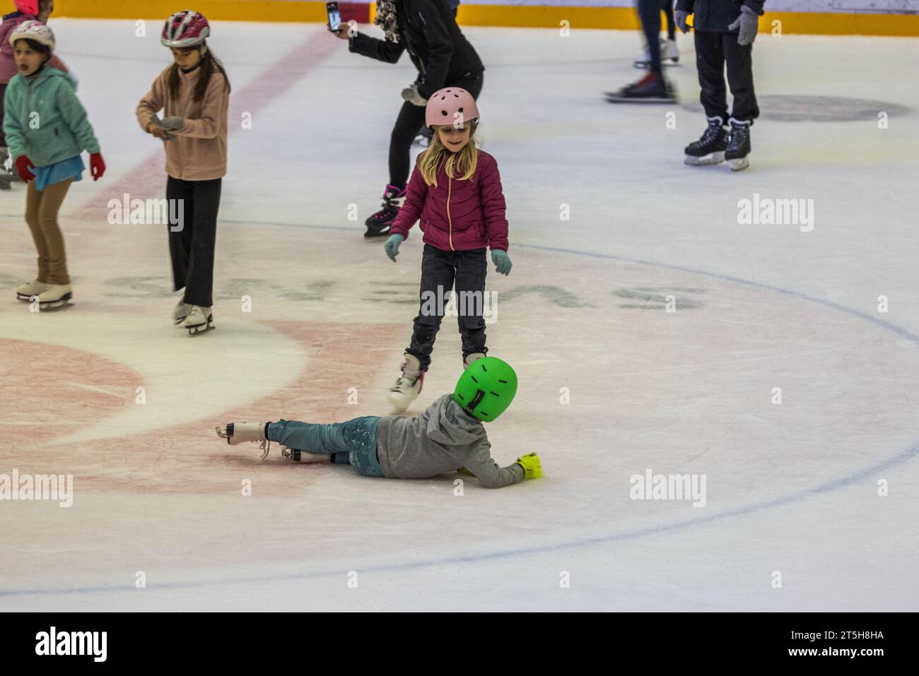 On weekends children skate alongside their parents on ice rink at ...