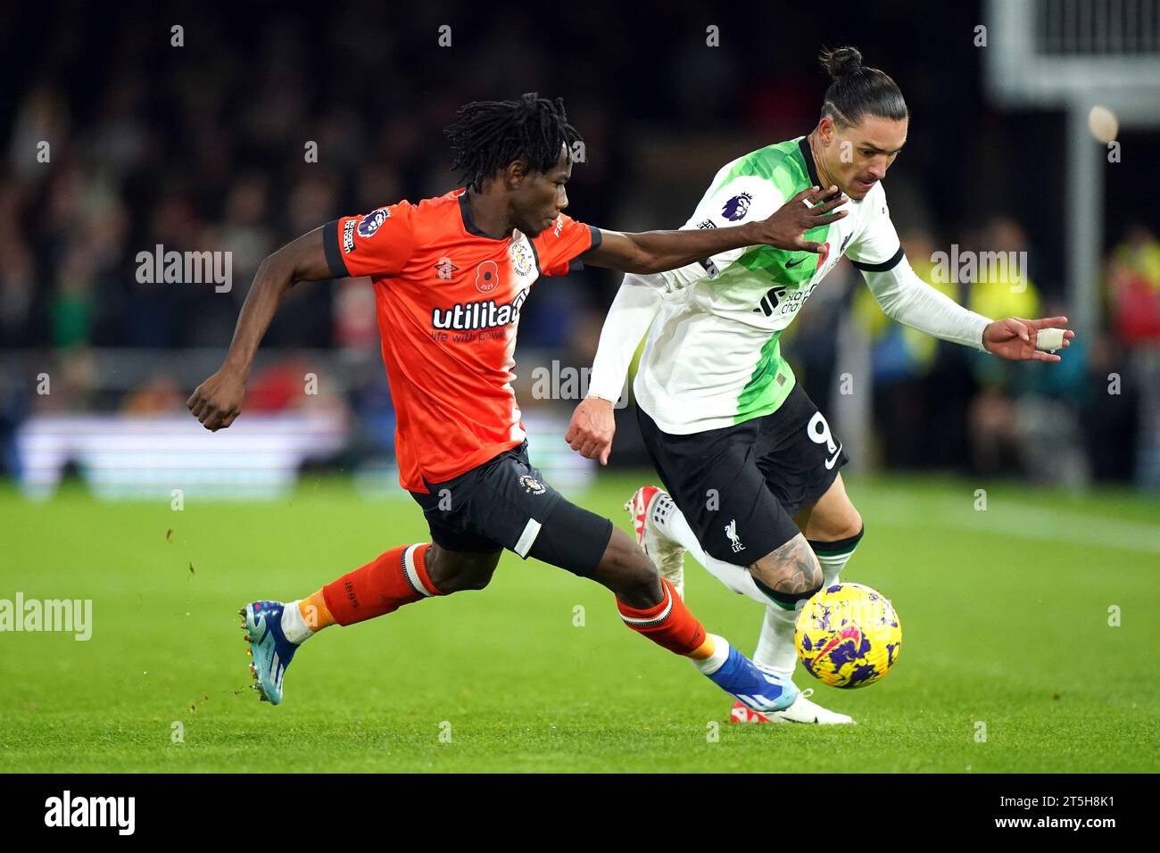 Liverpool's Darwin Nunez (right) and Luton Town's Issa Kabore battle ...