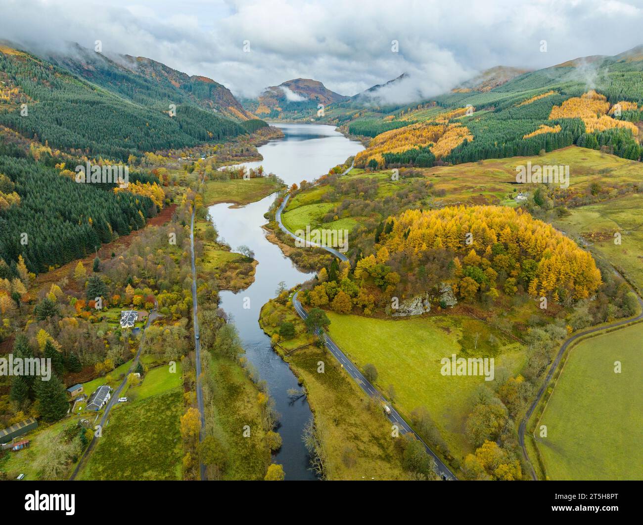 Aerial view of autumn colours beside the Garbh Uisge river and Loch ...