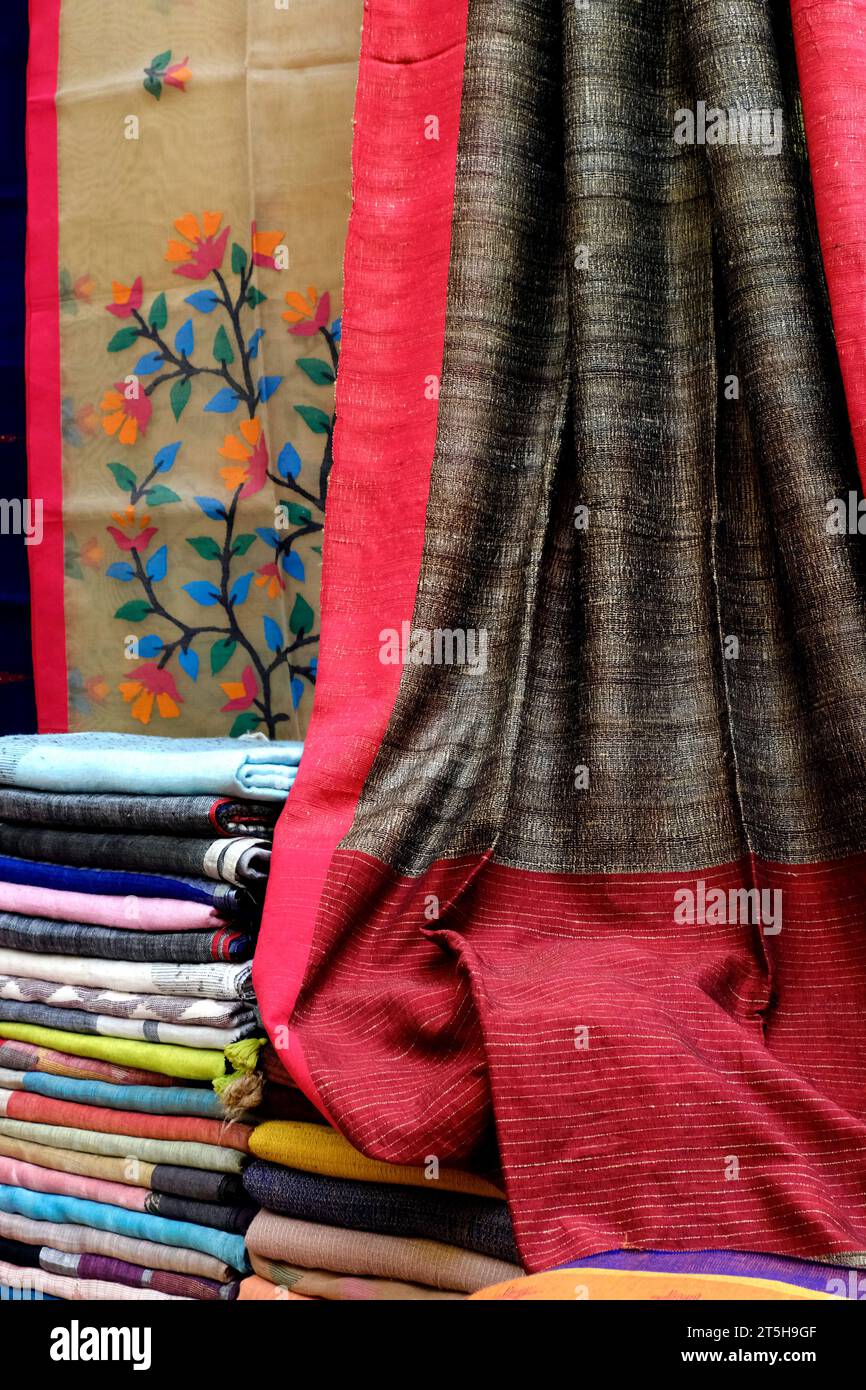 Fancy Indian sarees, Neatly stacked colorful silk saris in racks in a ...