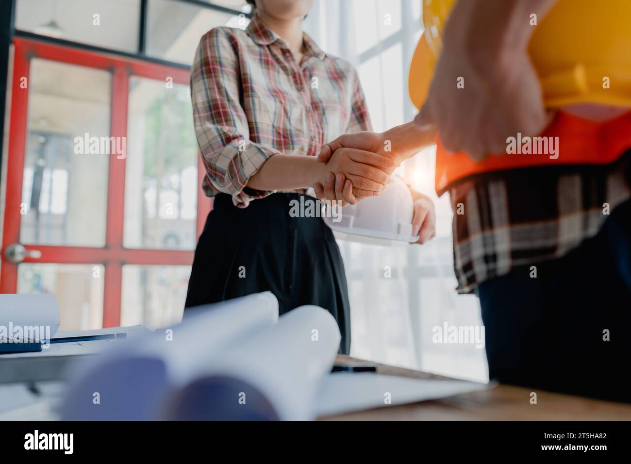 Engineers, designers and interior designers are handshake shack hands ...