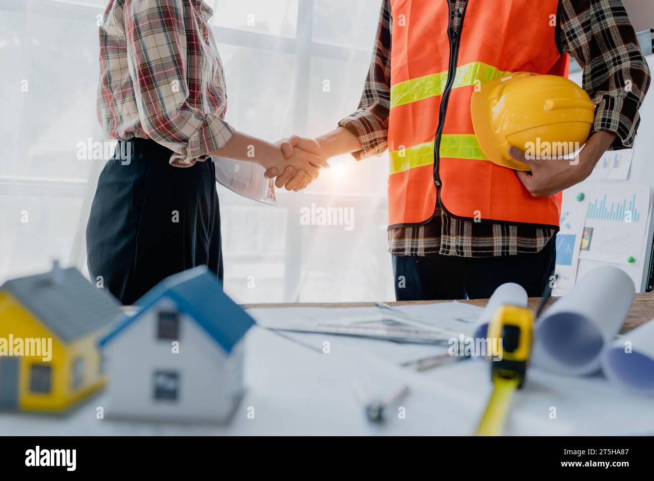 Engineers, designers and interior designers are handshake shack hands ...