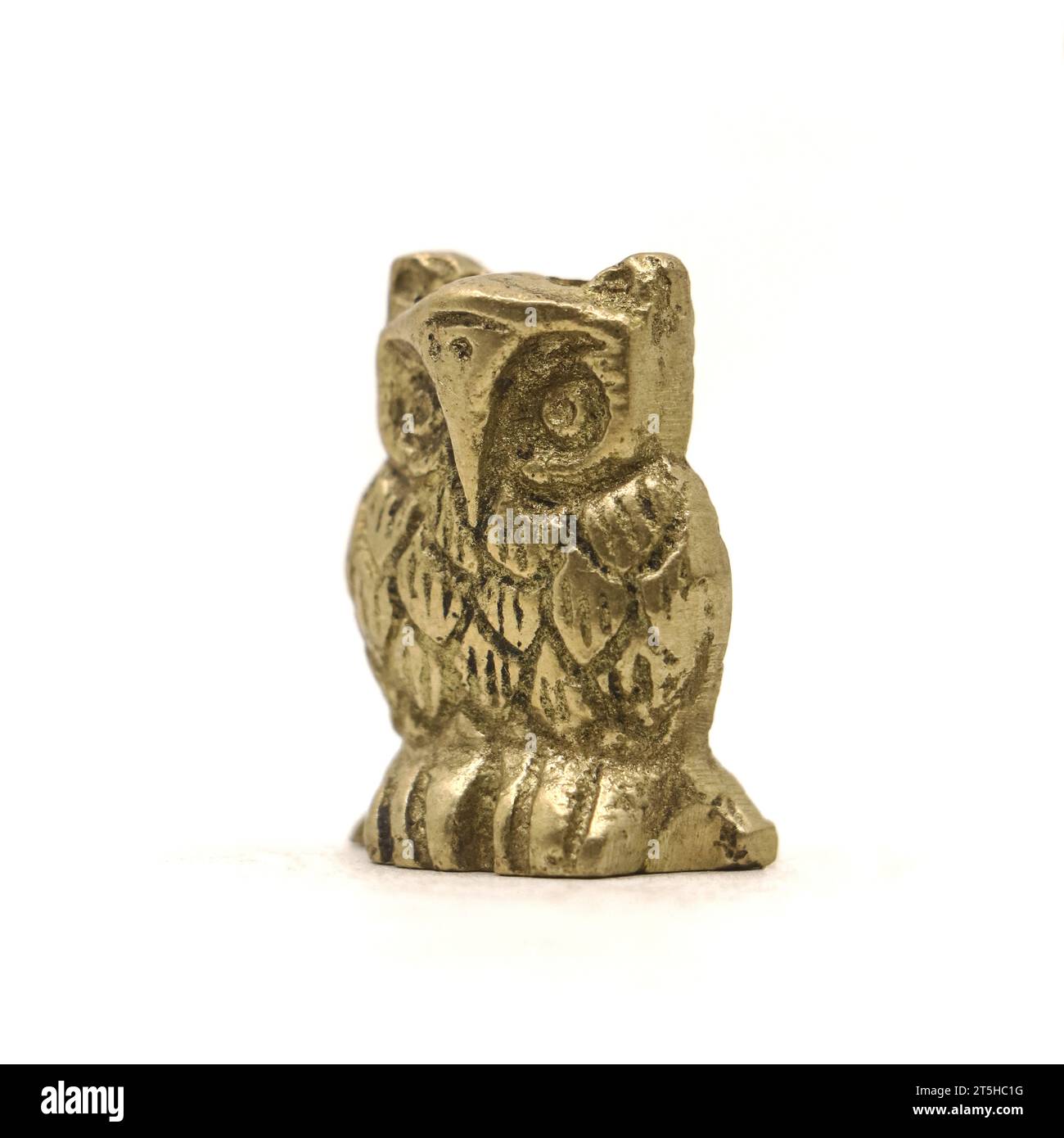 antique bronze owl figurine with old worn out carvings isolated on ...