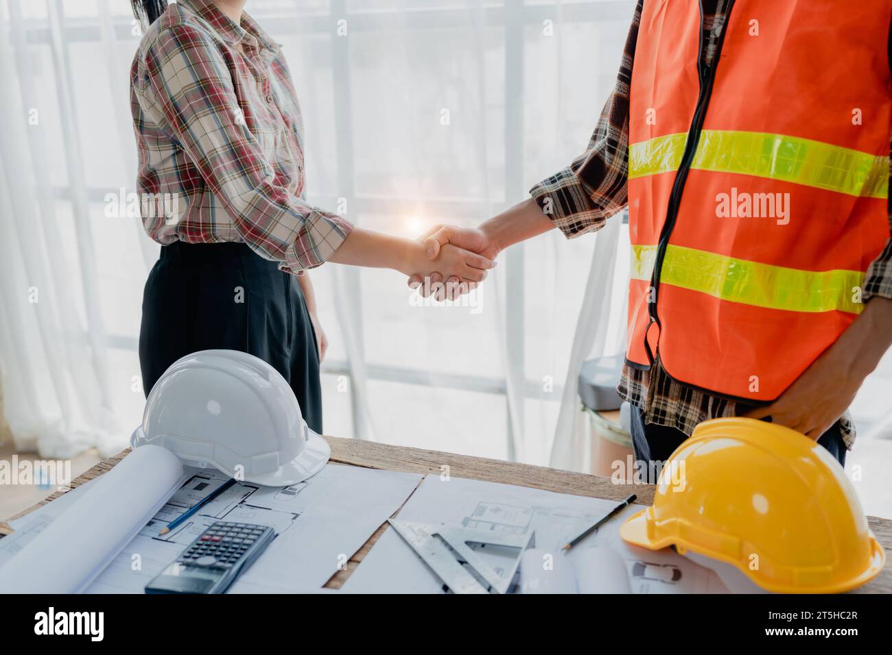 Engineers, designers and interior designers are handshake shack hands ...
