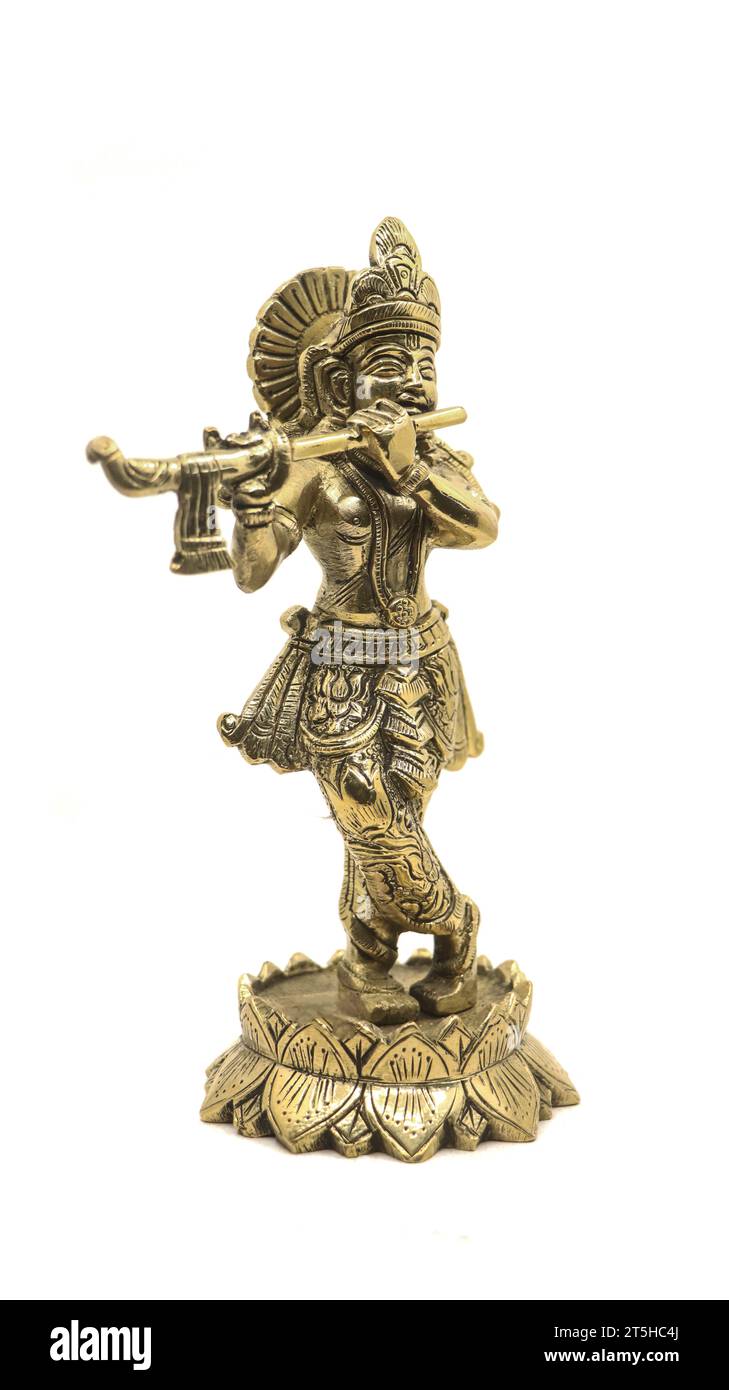 lord krishna golden idol isolated in a white background Stock Photo - Alamy