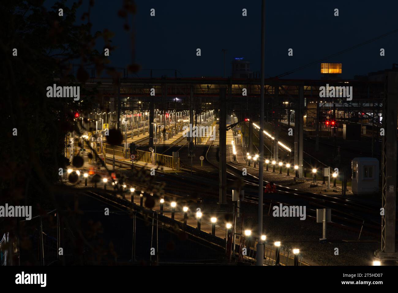 A view of the platforms at Cambridge train station at night. England ...