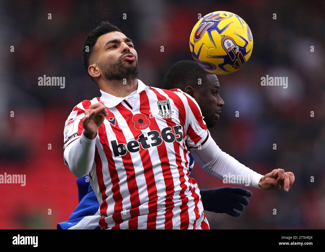 Stoke City's Mehdi Leris (left) and Cardiff City's Jamilu Collins ...