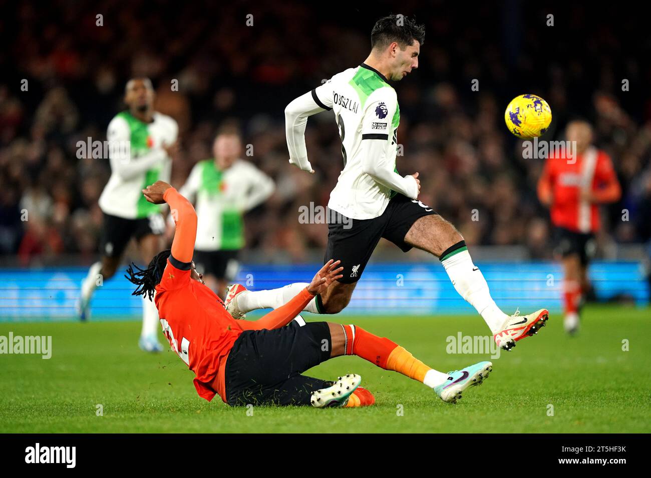 Luton Town's Gabriel Osho attempts to tackle Liverpool's Dominik ...